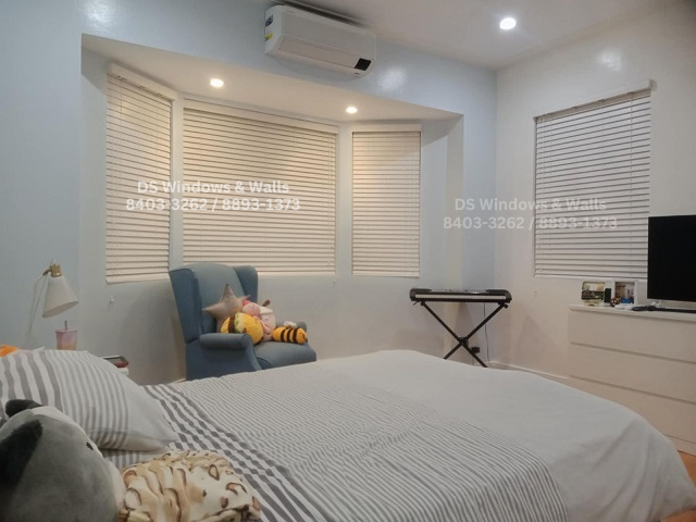 How all-white wood blinds soften the bedroom’s brightness - QC Project